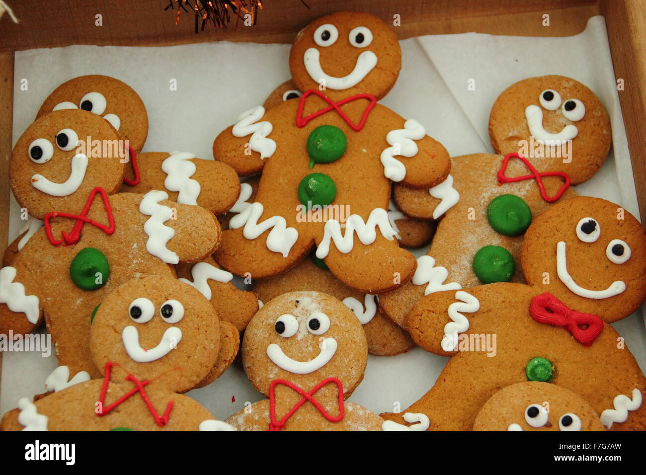 Gingerbread men iced with a smile at Christmas, England Stock Photo - Alamy