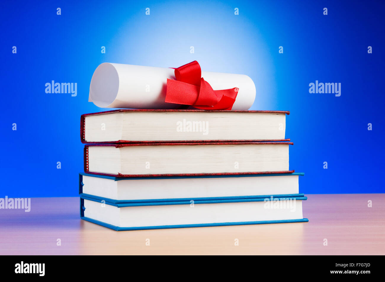 Diploma and stack of books against the background Stock Photo - Alamy