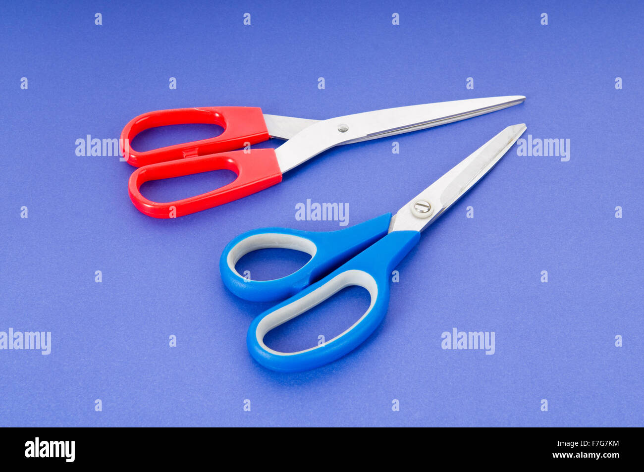Colorful scissors on the color paper background Stock Photo - Alamy