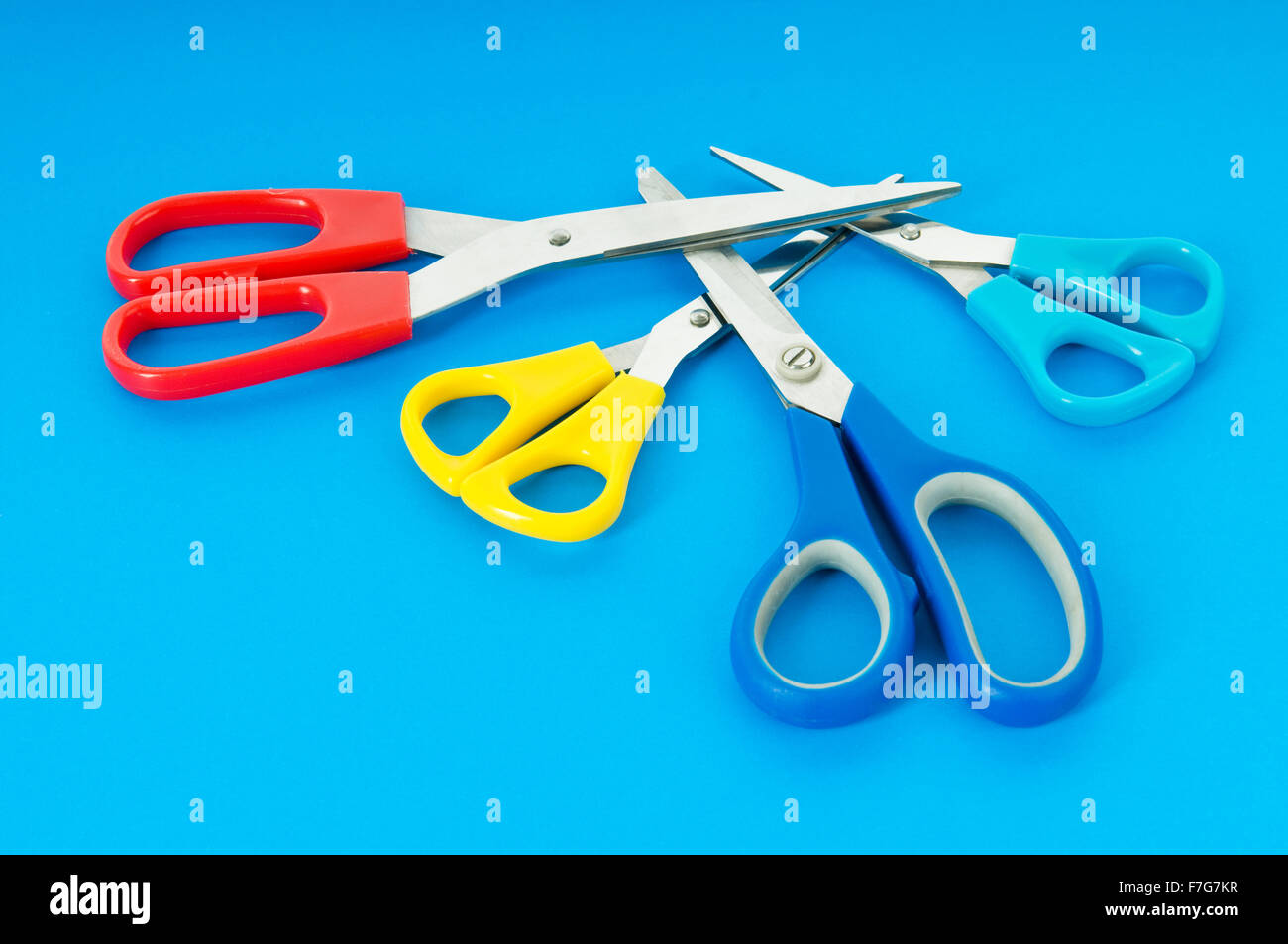 Colorful scissors on the color paper background Stock Photo - Alamy