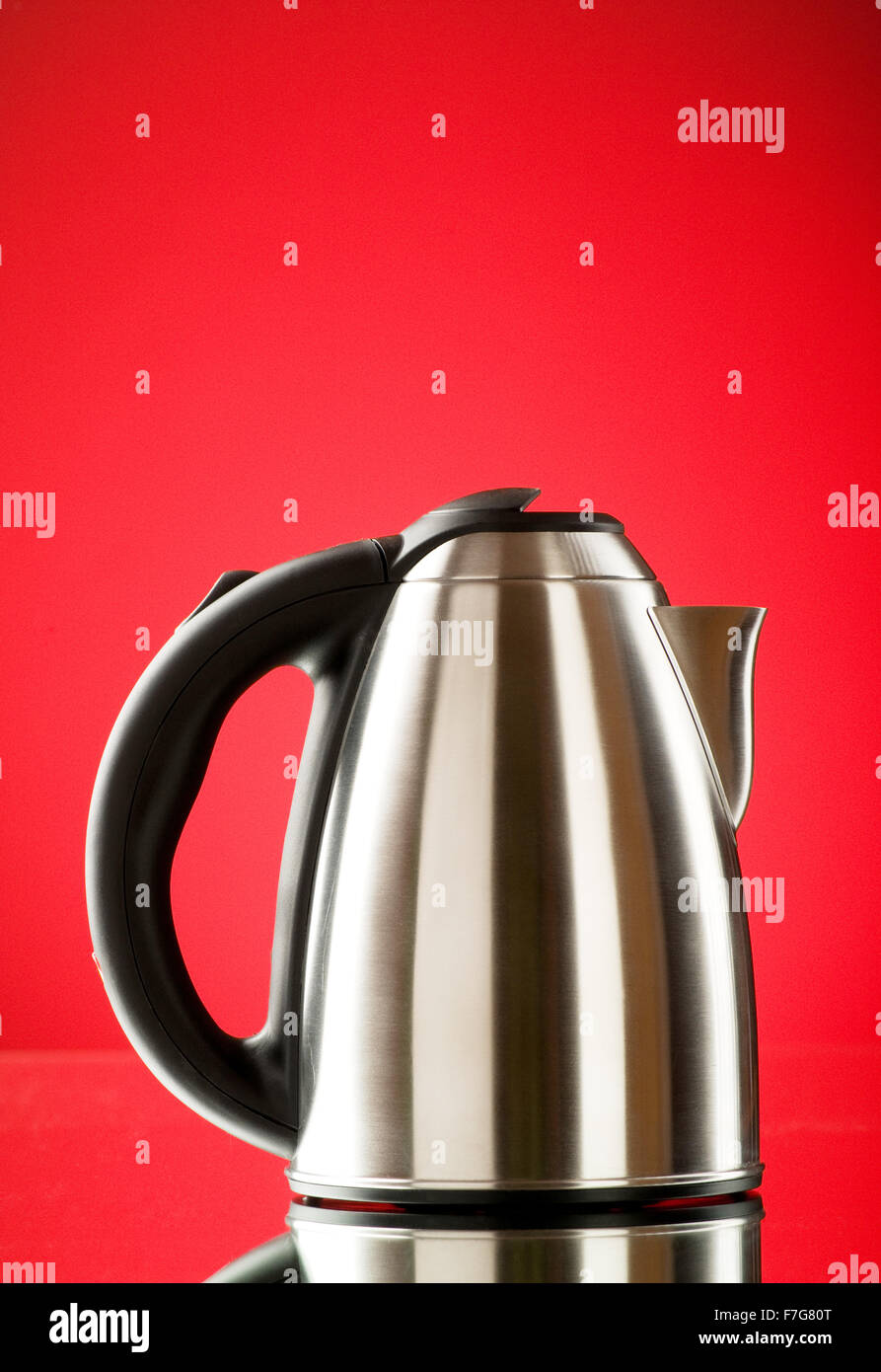 Shiny kettle against the colorful gradient background Stock Photo - Alamy