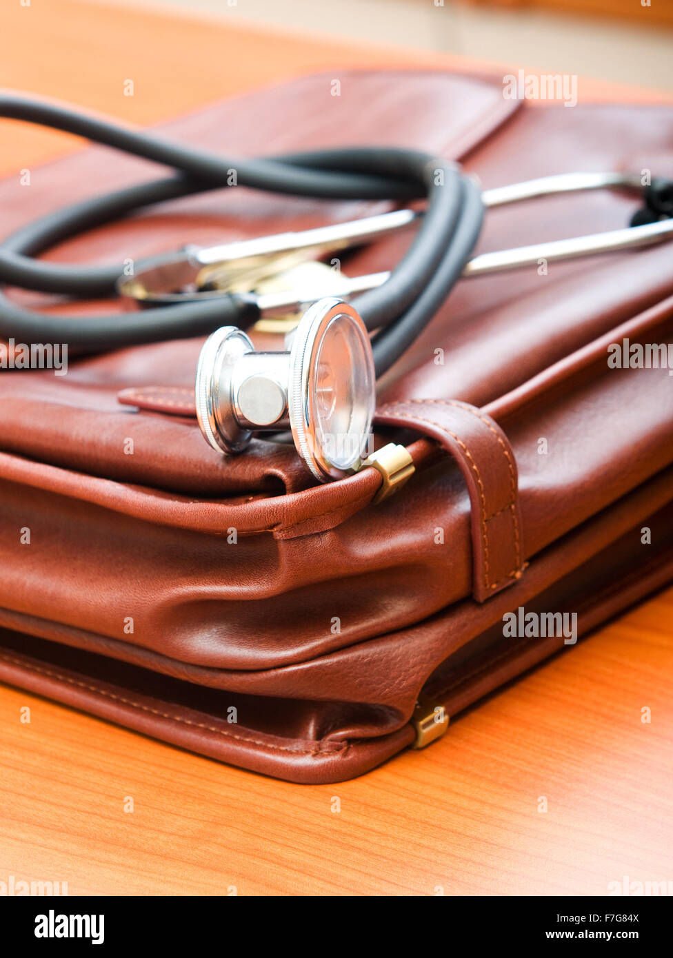 Doctor's case with stethoscope against wooden background Stock Photo ...