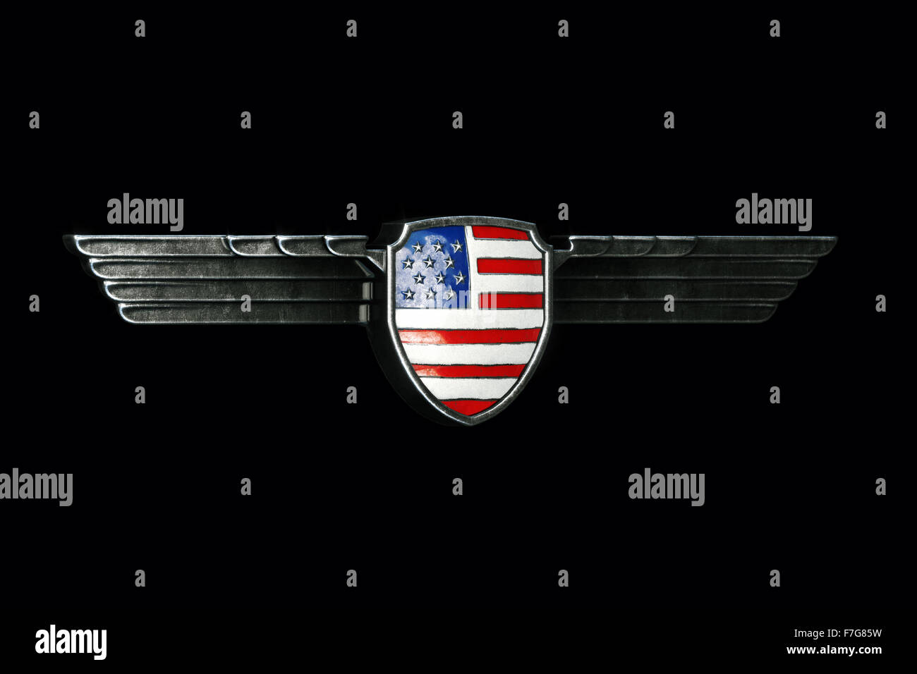 USA flag in metal wings frame isolated on black background. Perspective ...
