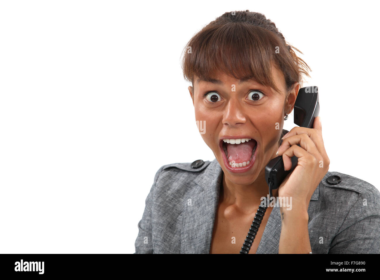 Woman shocked on the phone Stock Photo - Alamy