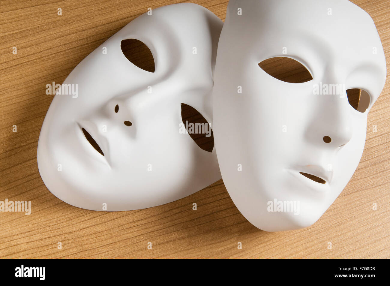 Theatre concept with the white plastic masks Stock Photo - Alamy