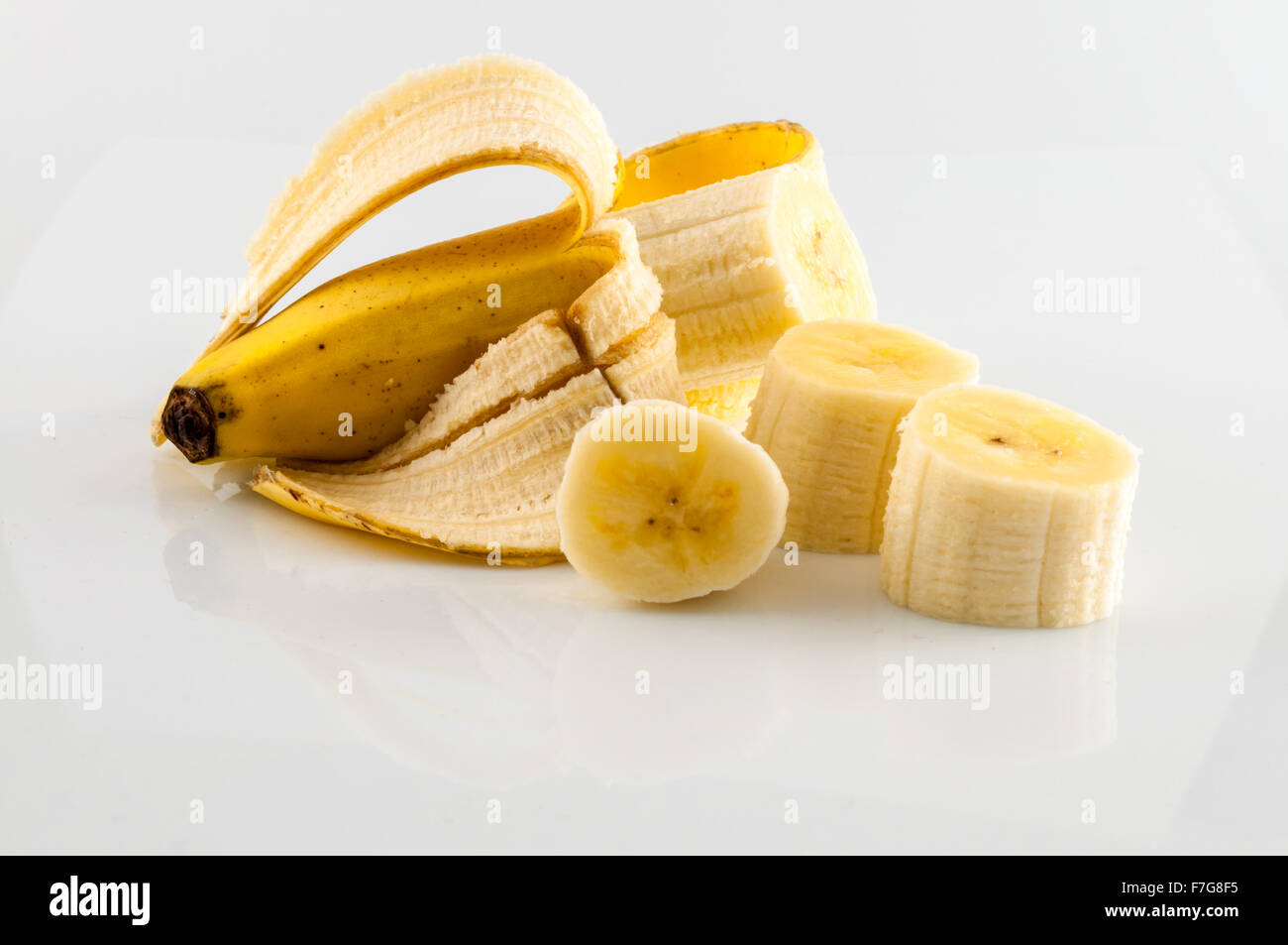 half banana and slices isolated on white background Stock Photo - Alamy
