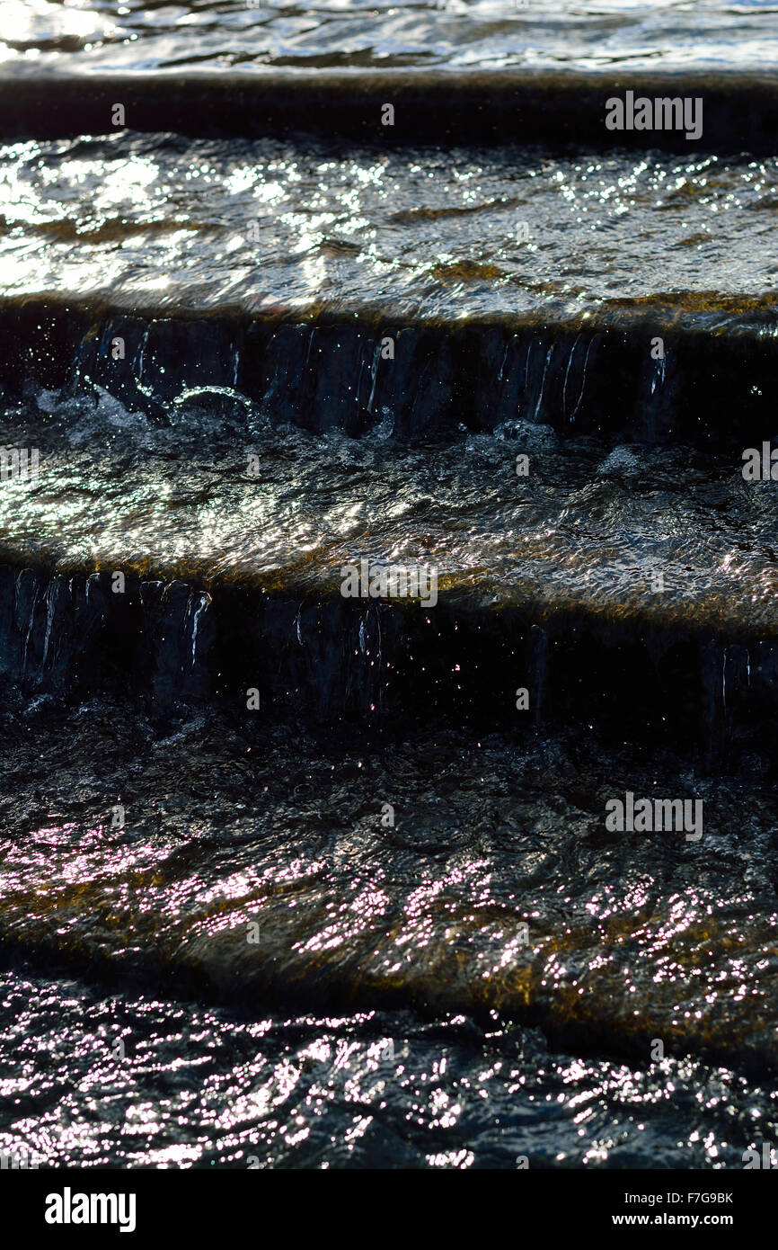 water cascading down steps of a weir Stock Photo - Alamy