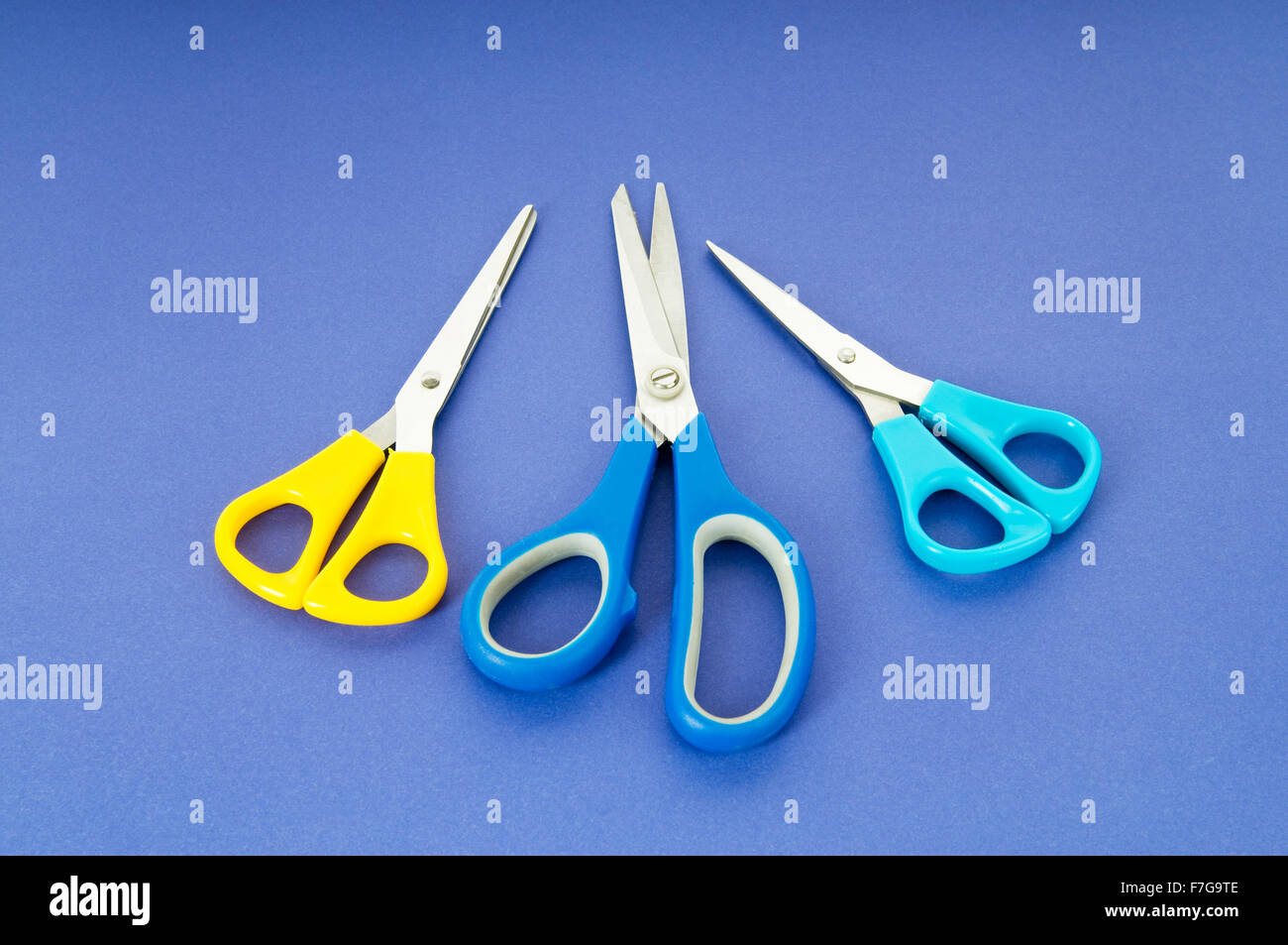 Colorful scissors on the color paper background Stock Photo - Alamy