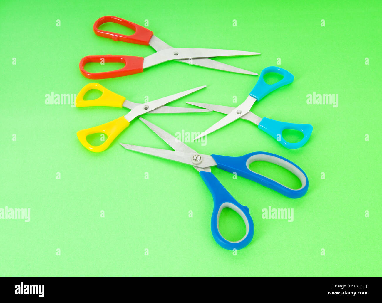 Colorful scissors on the color paper background Stock Photo - Alamy