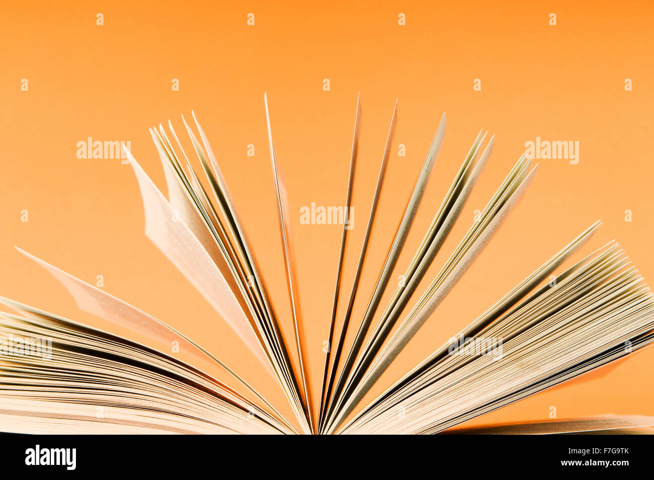 Stack of books on the color background Stock Photo - Alamy