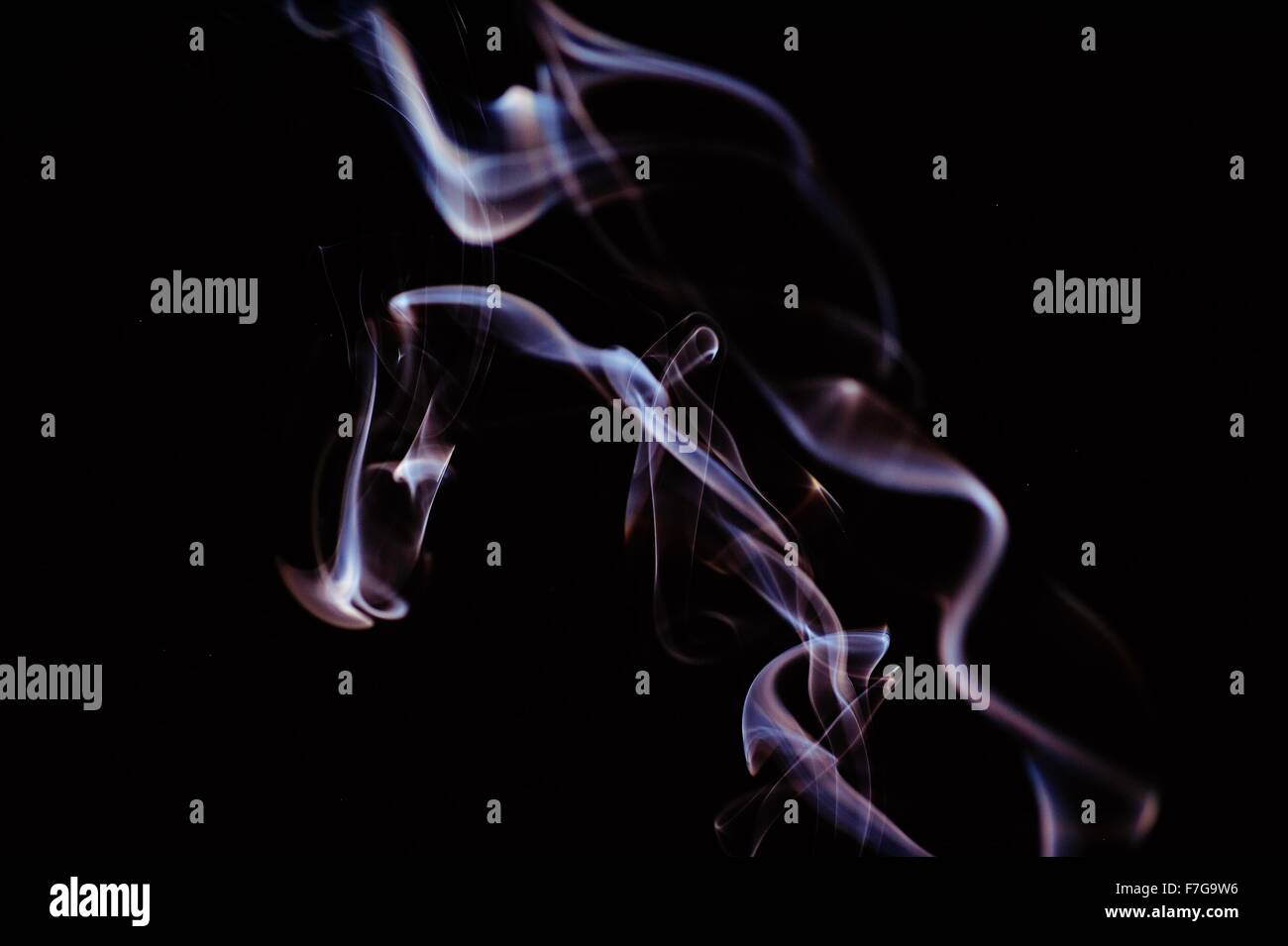 A studio photo of a insense candle smoke Stock Photo - Alamy