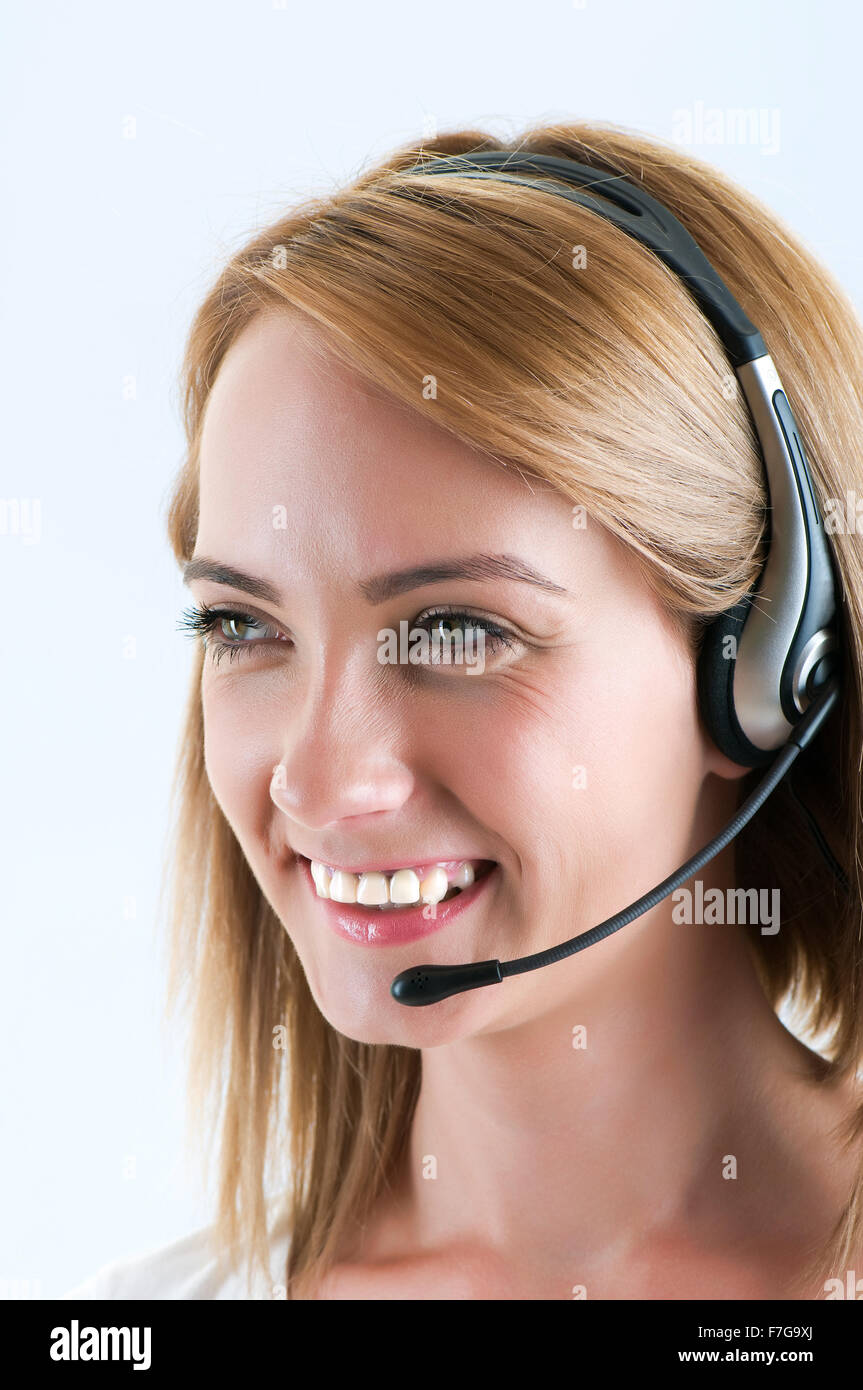 Young call center operator with the headset Stock Photo - Alamy
