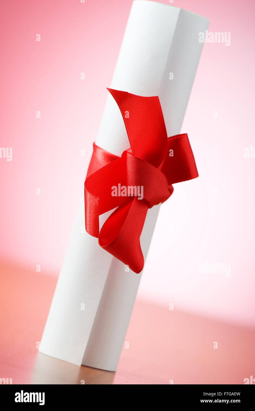Education concept - diploma roll on the wooden table Stock Photo - Alamy