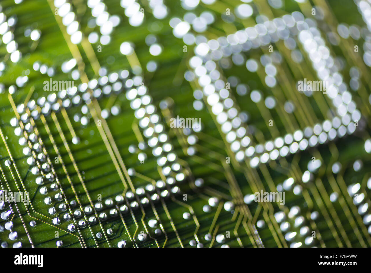 rows of soldered electrical components on circuit board showing solder ...