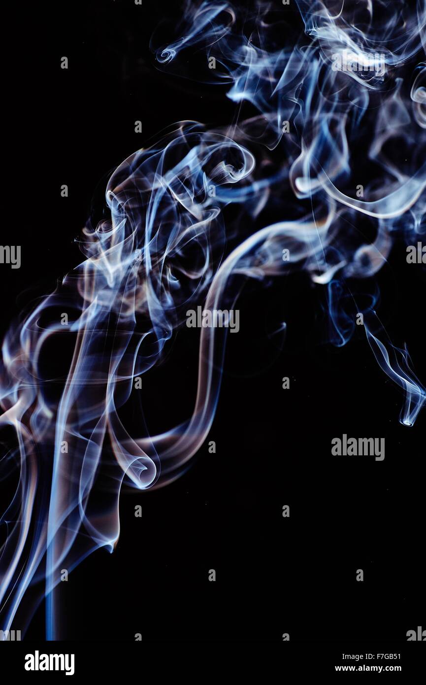 A studio photo of a insense candle smoke Stock Photo - Alamy