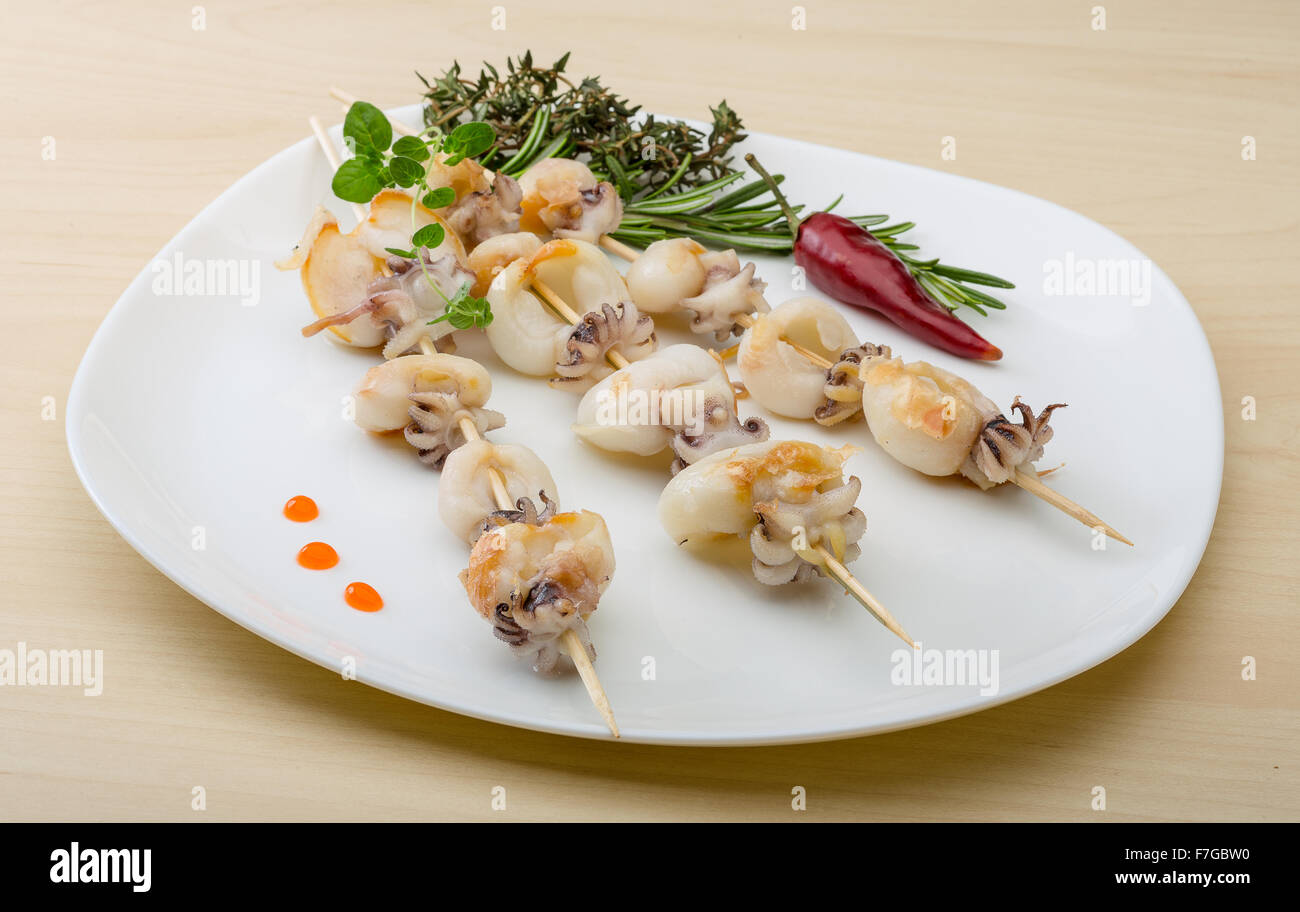 Grilled cuttlefish bbq with rosemary and pepper Stock Photo - Alamy