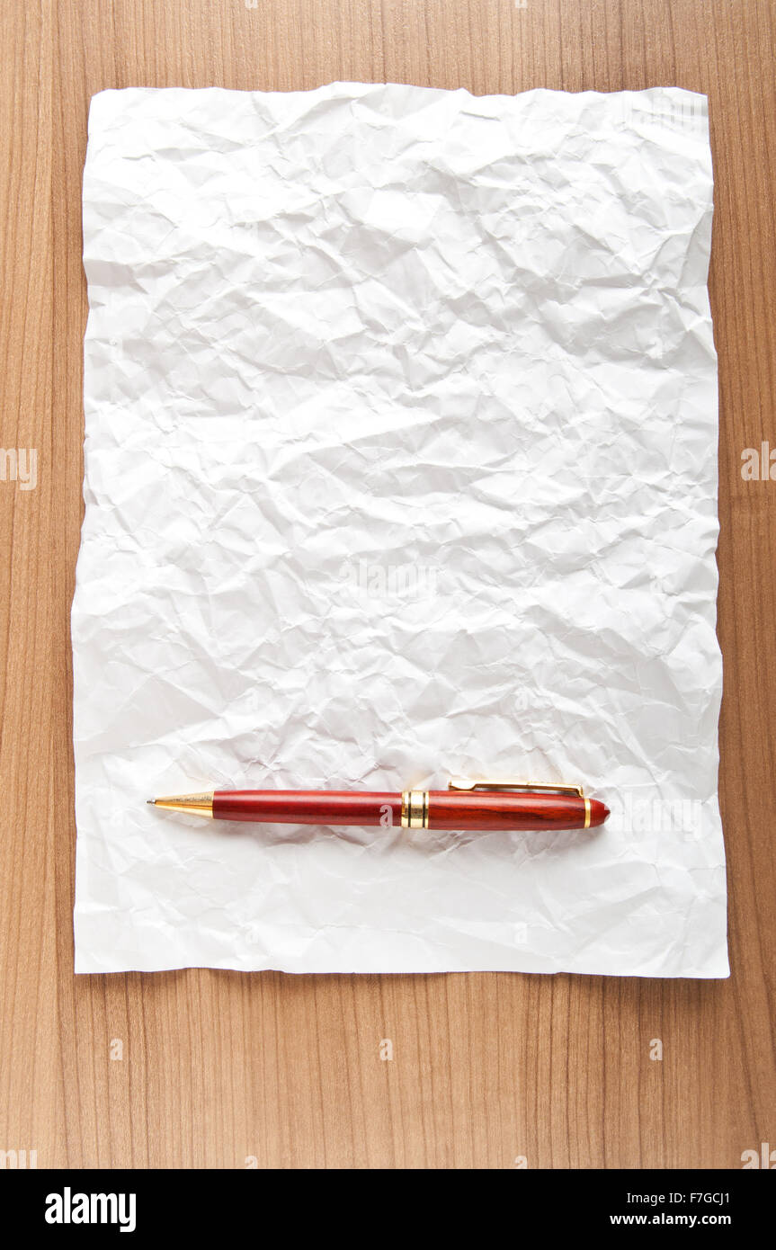 Paper background with pen Stock Photo - Alamy