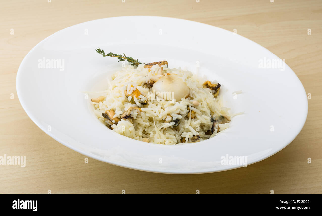 Risotto with mussels and cuttlefish served fresh thyme Stock Photo - Alamy