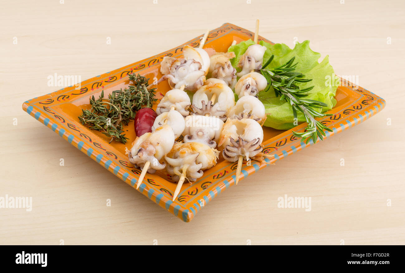 Grilled cuttlefish bbq with rosemary and pepper Stock Photo - Alamy