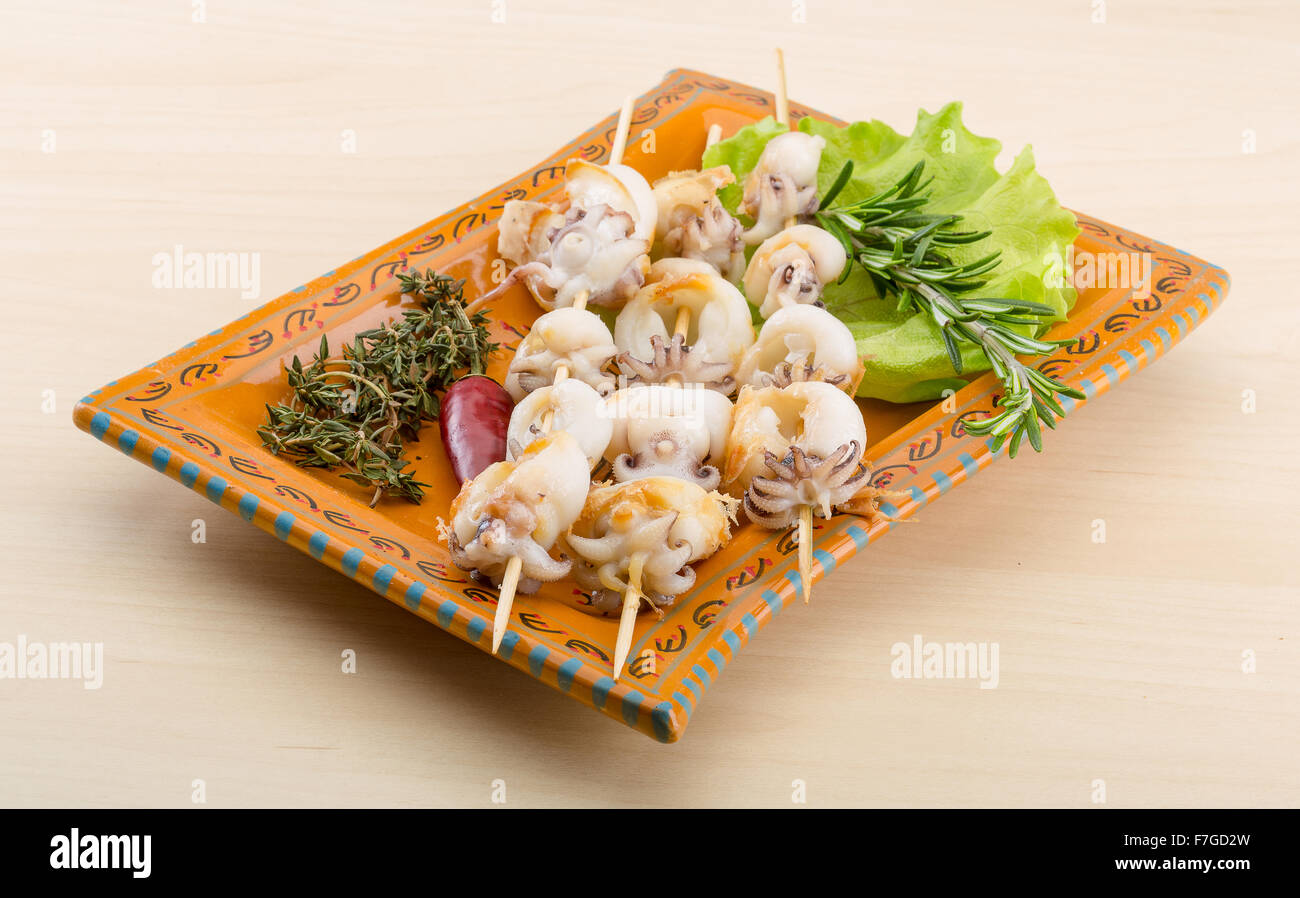 Grilled cuttlefish bbq with rosemary and pepper Stock Photo - Alamy