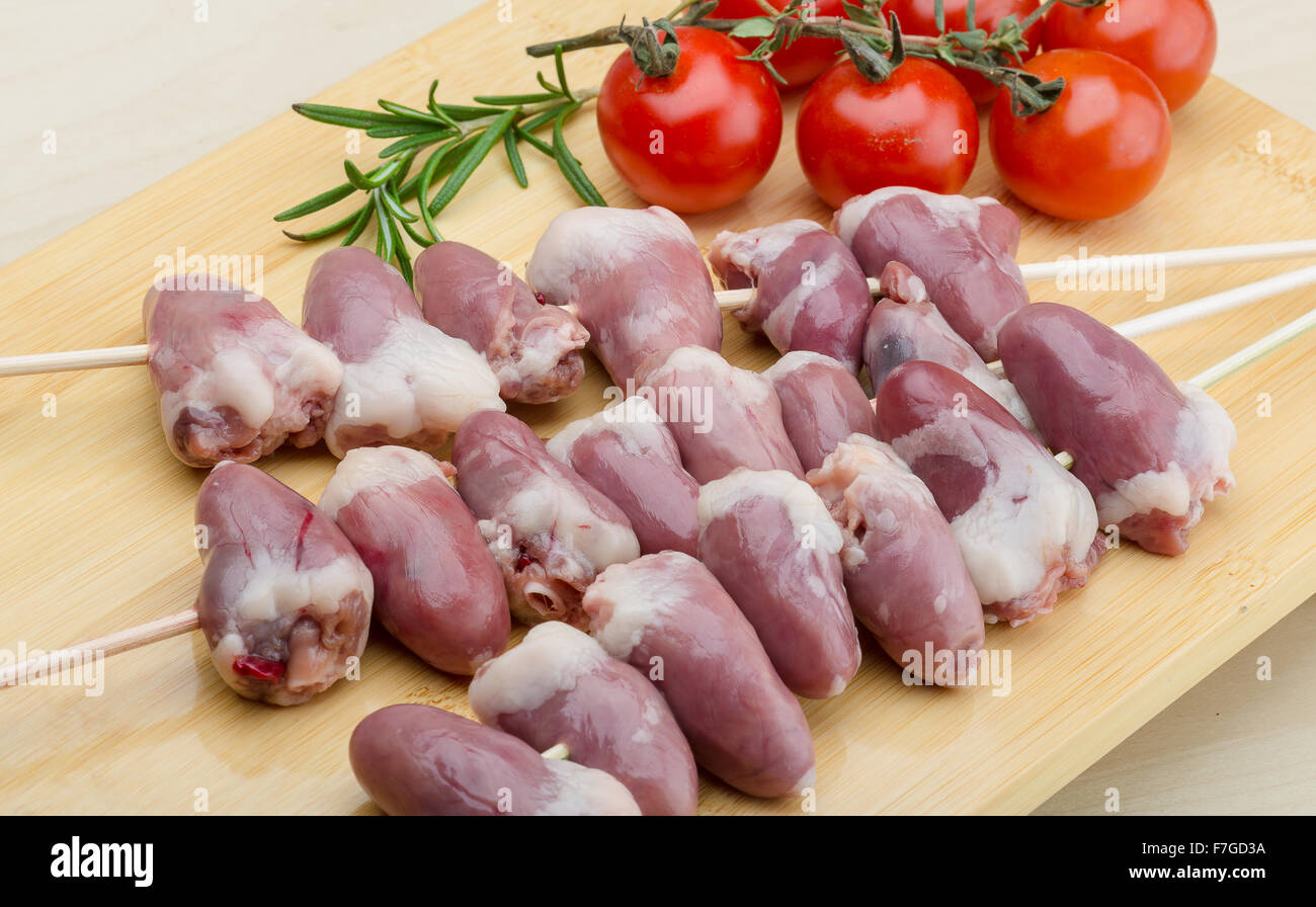Raw chicken hearts ready for barbecue with rosemary Stock Photo - Alamy
