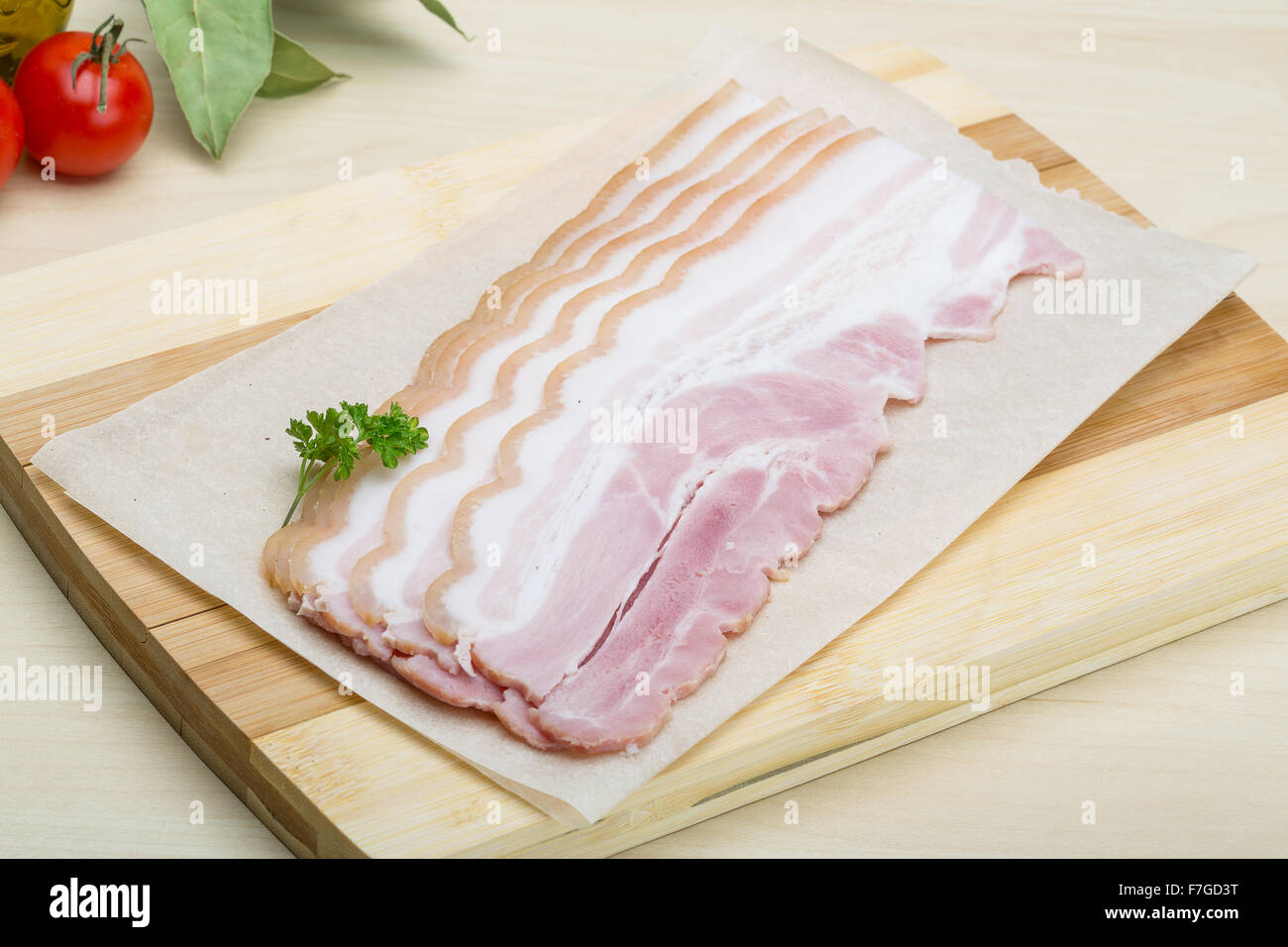 Raw Bacon strips on the wood background Stock Photo - Alamy