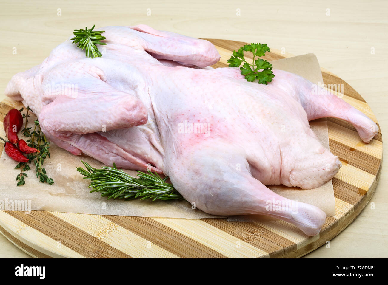 Raw duck with rosemary and spices - ready for cooking Stock Photo - Alamy