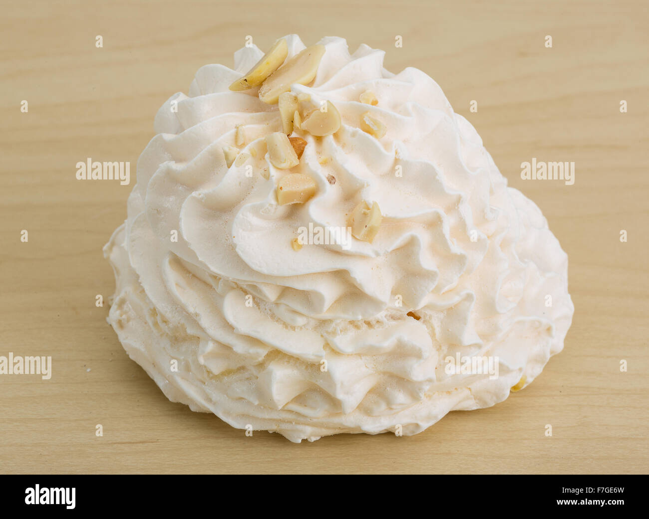 White meringue with nut on the wood background Stock Photo - Alamy