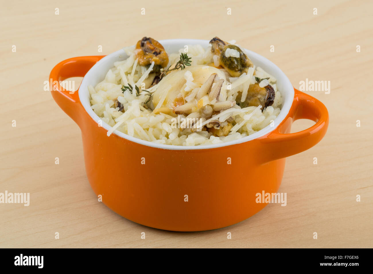 Risotto with mussels and cuttlefish served fresh thyme Stock Photo - Alamy