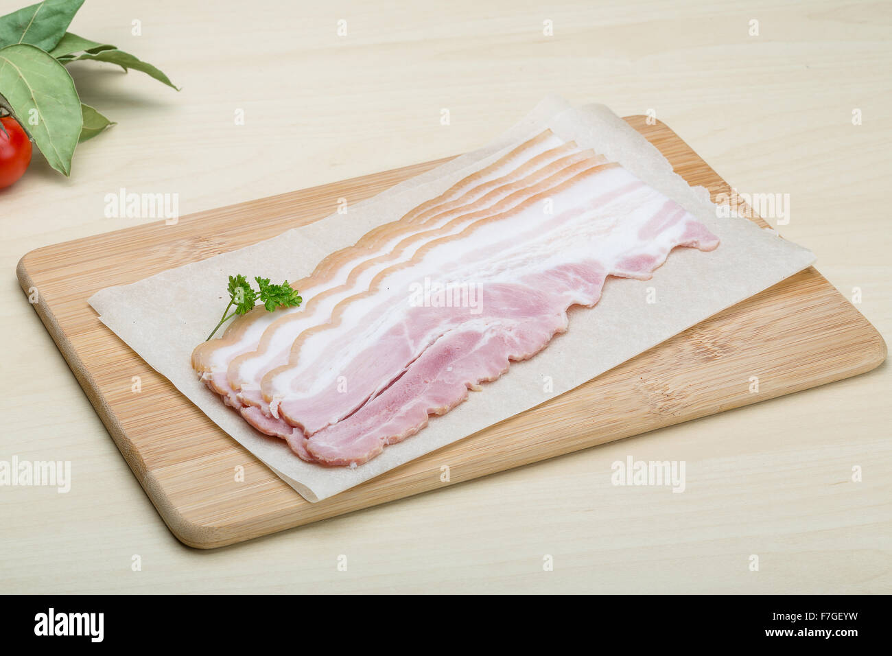 Raw Bacon strips on the wood background Stock Photo - Alamy