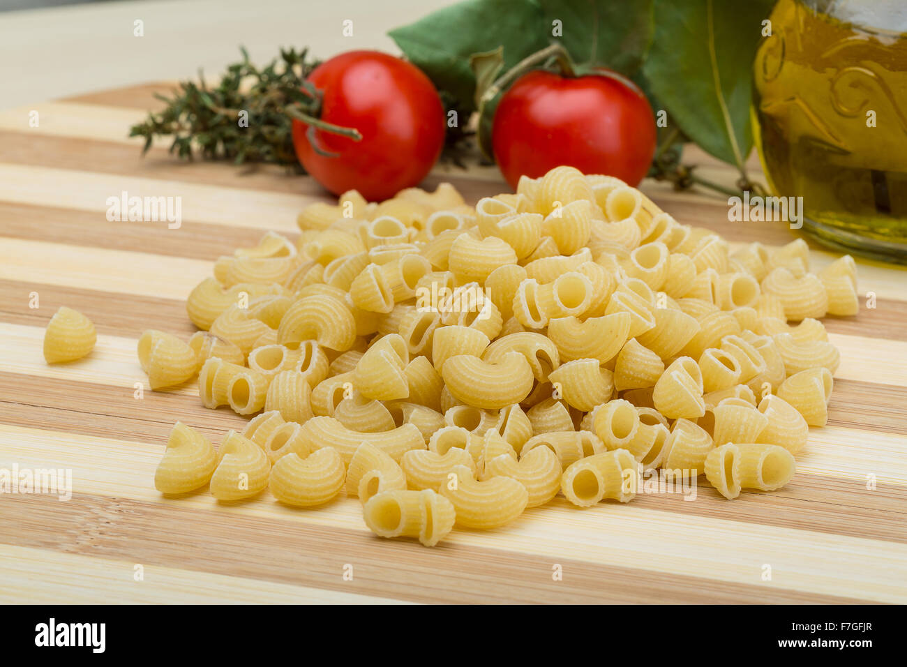 Pipe rigate pasta on the wood background Stock Photo - Alamy