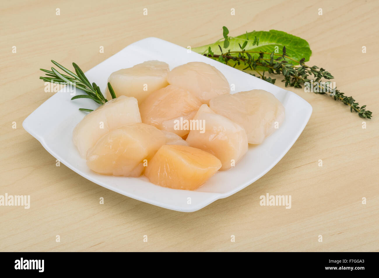 Raw scallops with rosemary - ready for cooking Stock Photo - Alamy
