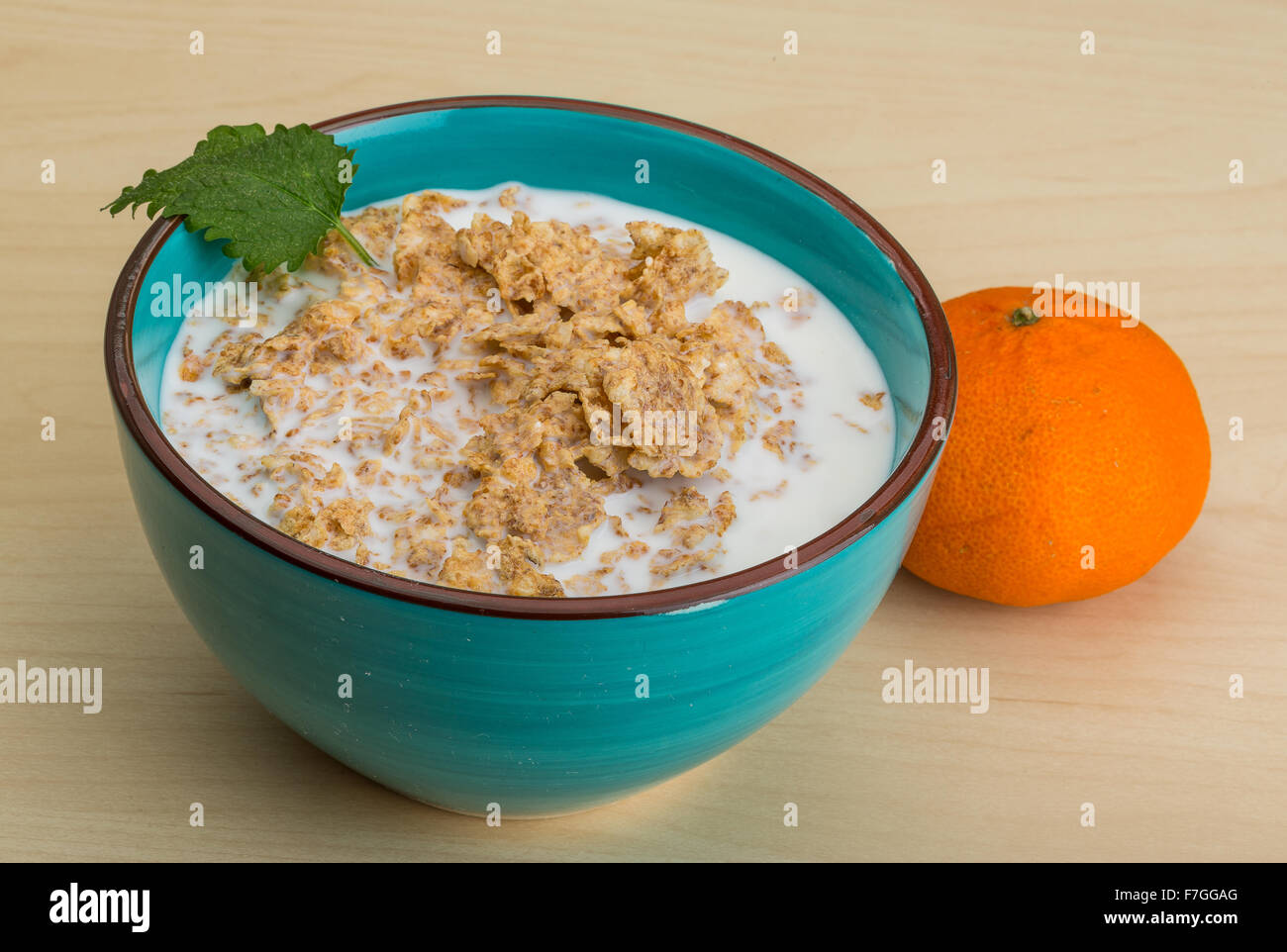 Cornflakes with tangerine and fresh mint leaves Stock Photo - Alamy