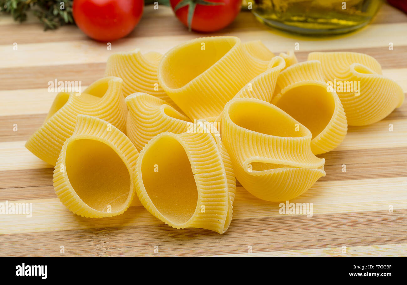 Pipe rigate pasta on the wood background Stock Photo - Alamy