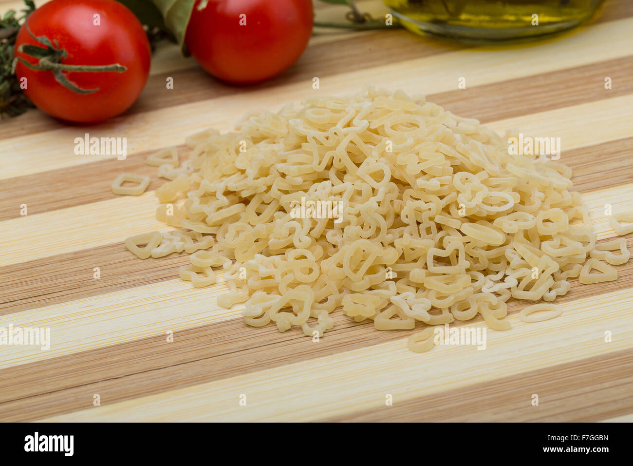Raw ABC macaroni on the wood background Stock Photo - Alamy