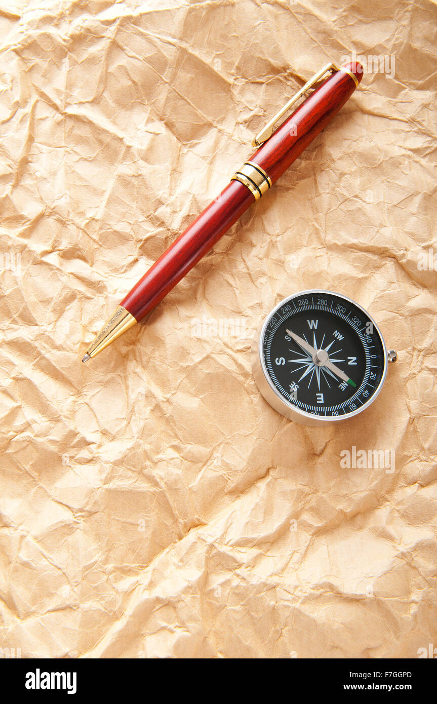 Vintage compass on the paper in adventure concept Stock Photo - Alamy
