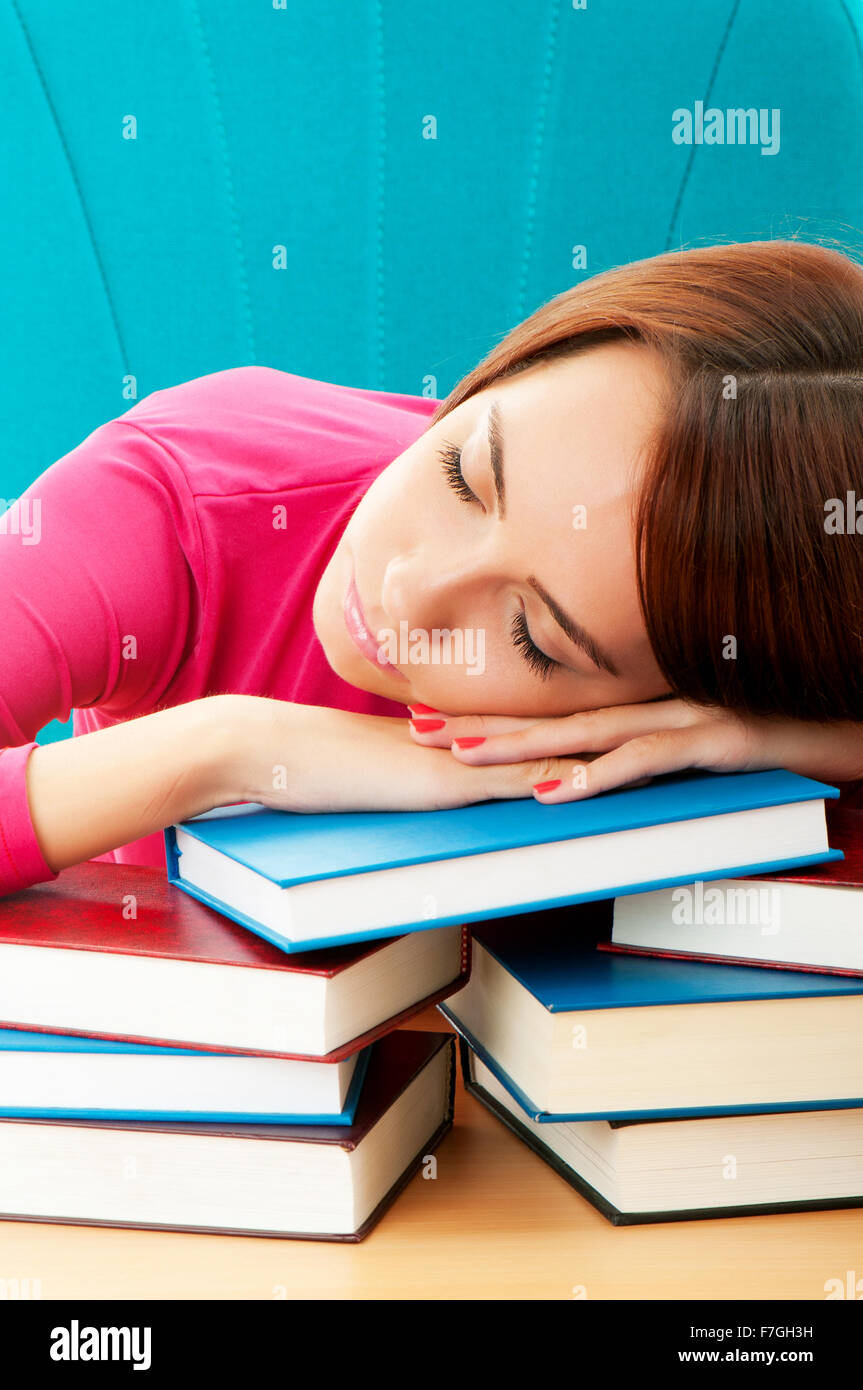 Young female student with many study books Stock Photo - Alamy