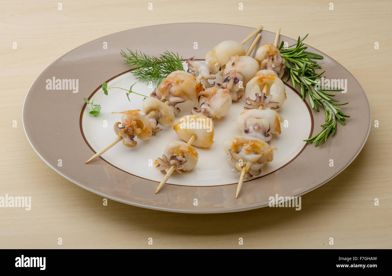 Grilled cuttlefish bbq with rosemary and pepper Stock Photo - Alamy