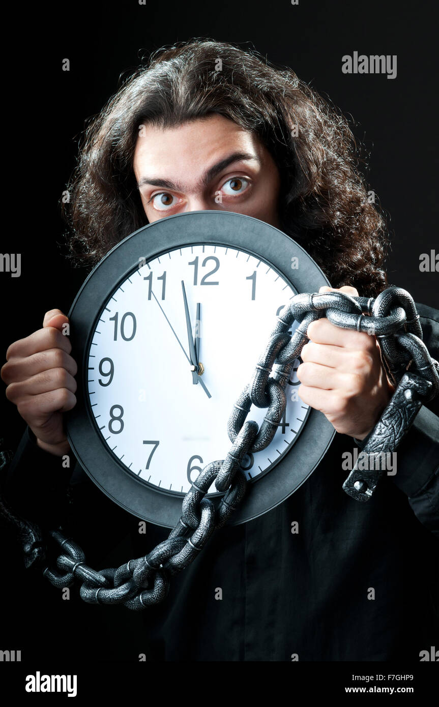 Man chained to the clock Stock Photo - Alamy