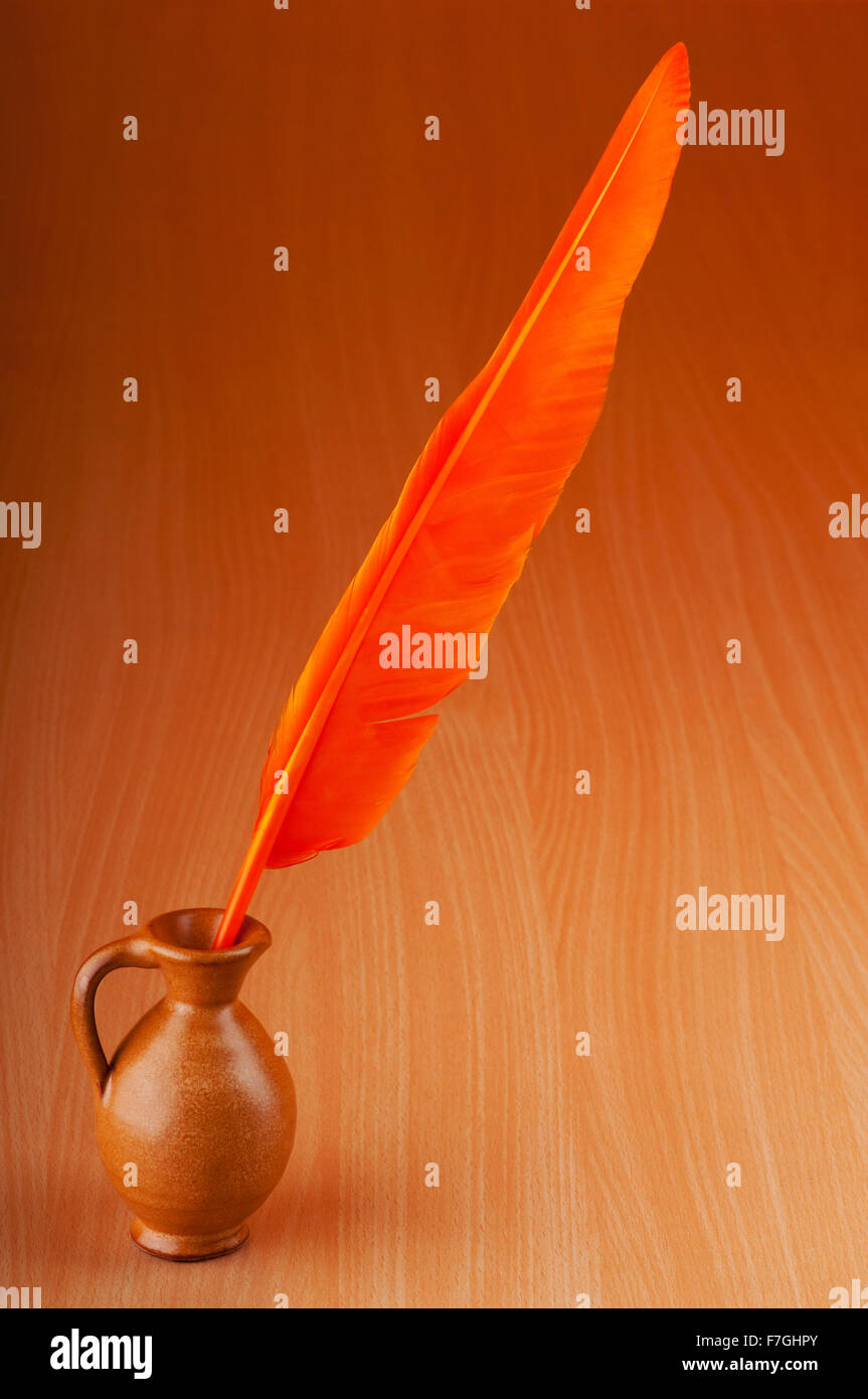 Writing feather against gradient background Stock Photo - Alamy