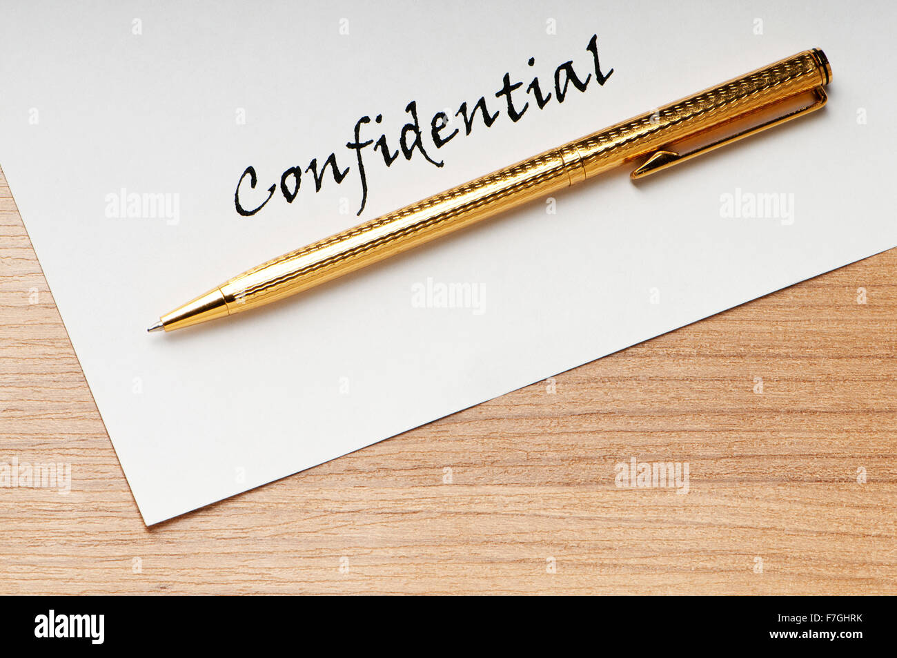 Pen and confidential message on white Stock Photo - Alamy