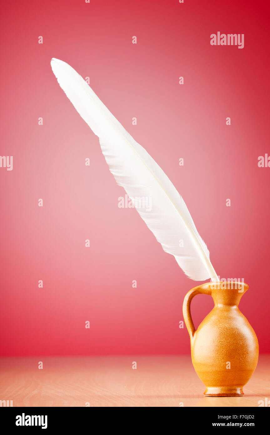 Writing feather against gradient background Stock Photo - Alamy