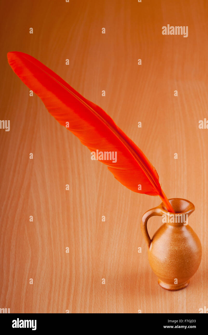 Writing feather against gradient background Stock Photo - Alamy