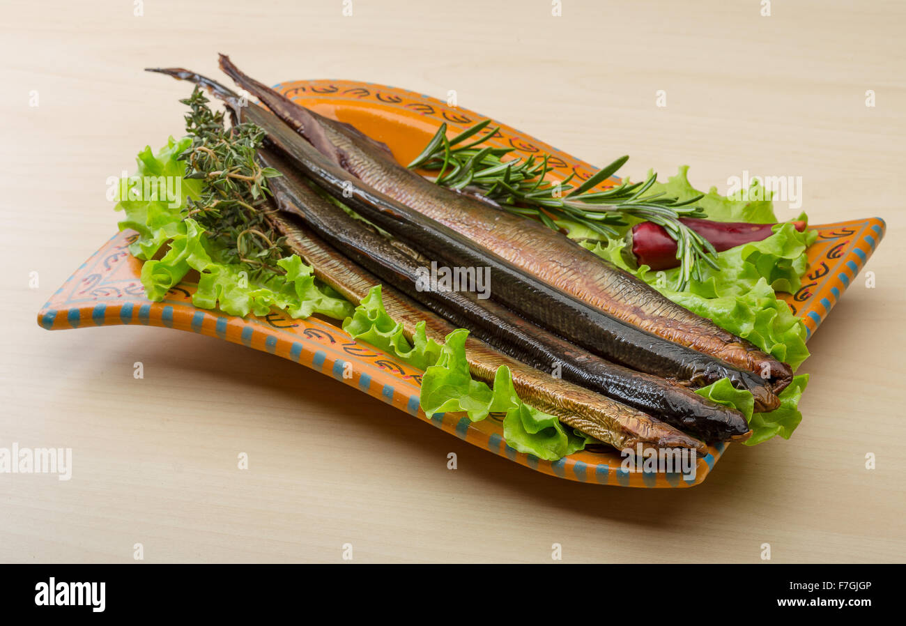 Smoked Lamprey - seafood delicacy with salad and herbs Stock Photo - Alamy