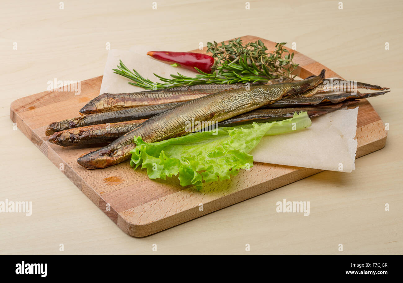 Smoked Lamprey - seafood delicacy with salad and herbs Stock Photo - Alamy