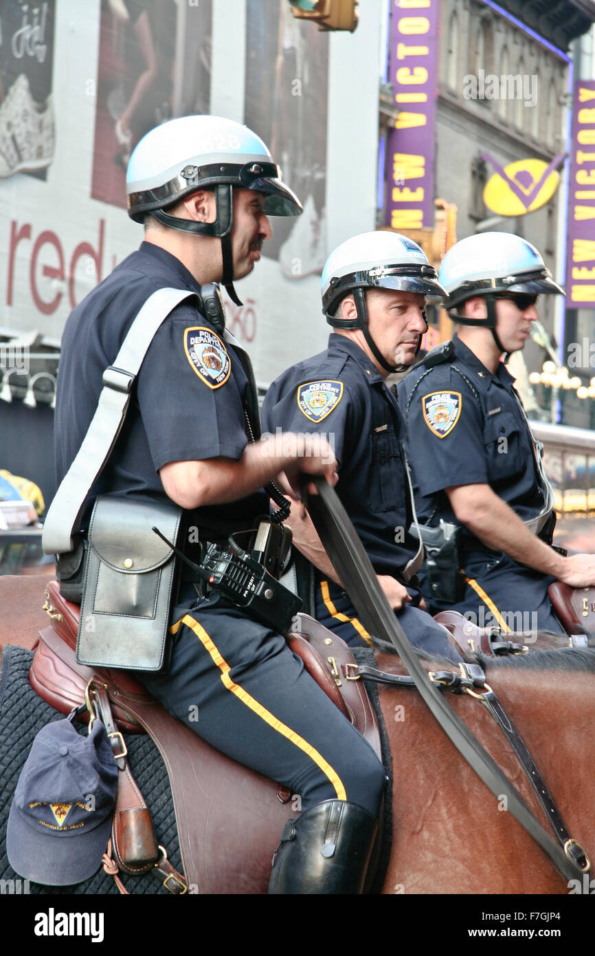 NEW YORK CITY - JUNE 26: police officers ride their horses downtown in ...