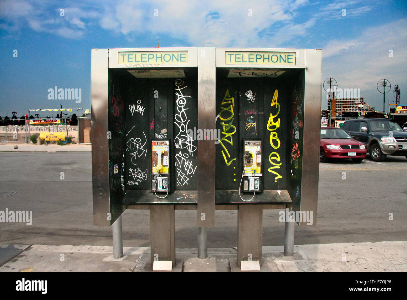 NEW YORK - JUNE 27: Pay phones with grafitti on Coney Island in ...