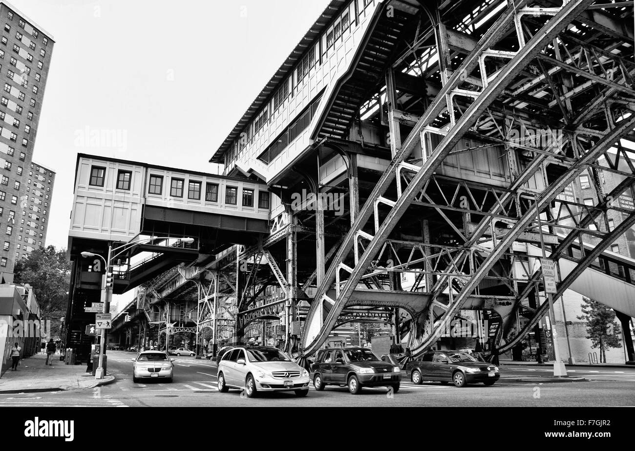 NEW YORK - JUN 22: Elevated train tracks and station buildings cast the ...