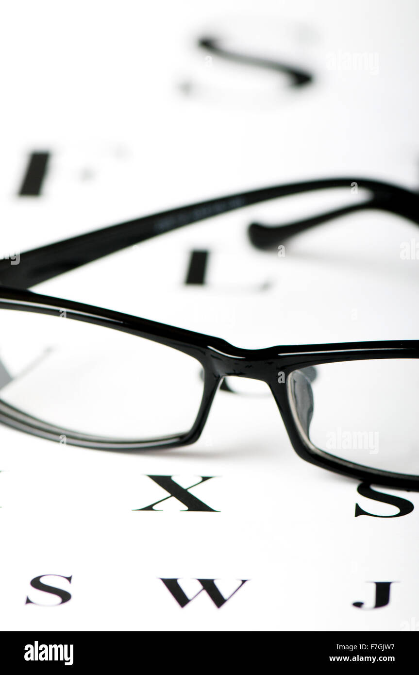 Optical reading glasses on the eyesight table Stock Photo - Alamy