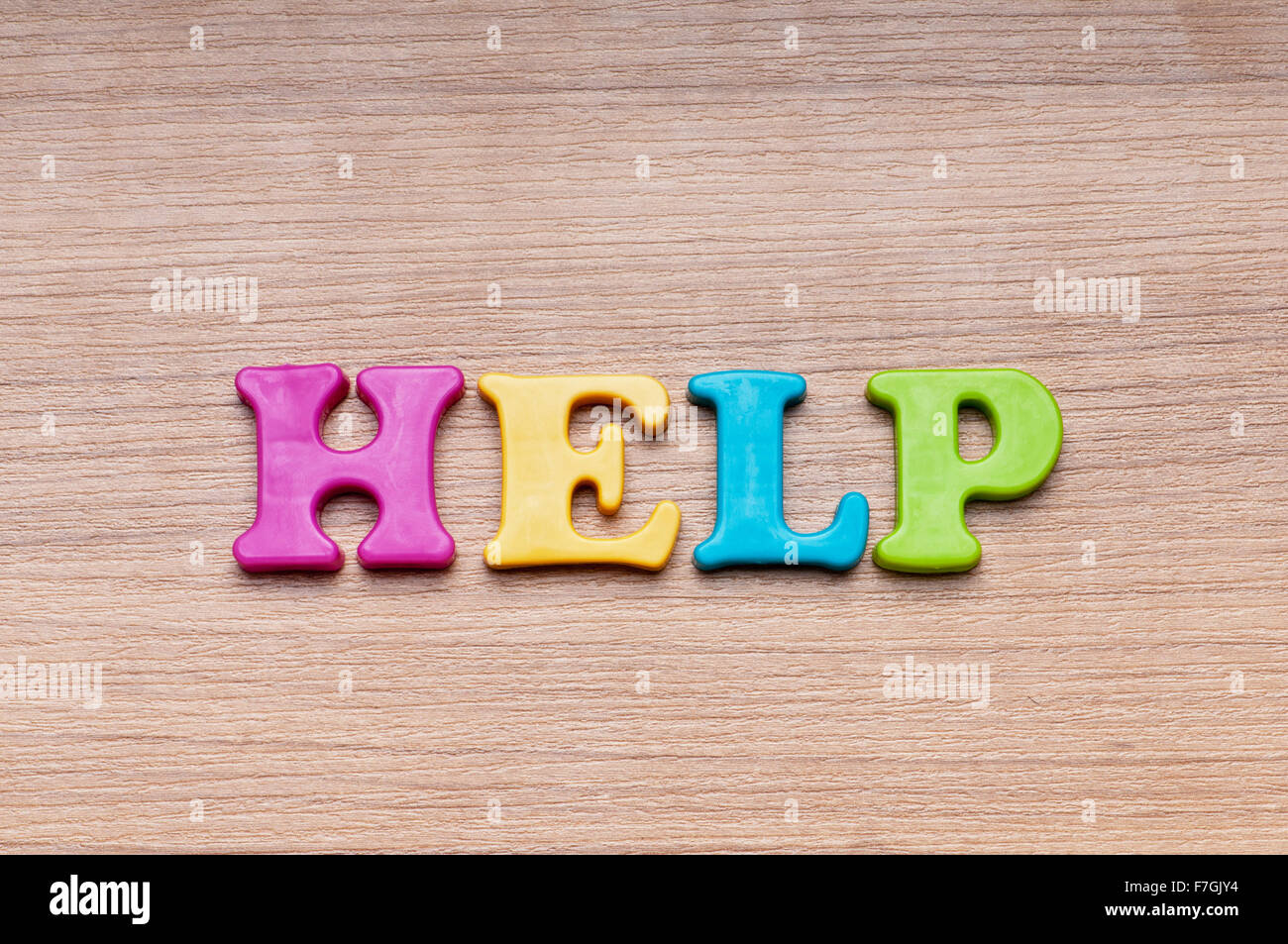 HELP concept with letters on background Stock Photo - Alamy